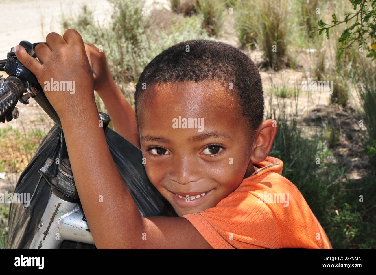 African boy with his bike smiling to the camera Stock Photo - Alamy