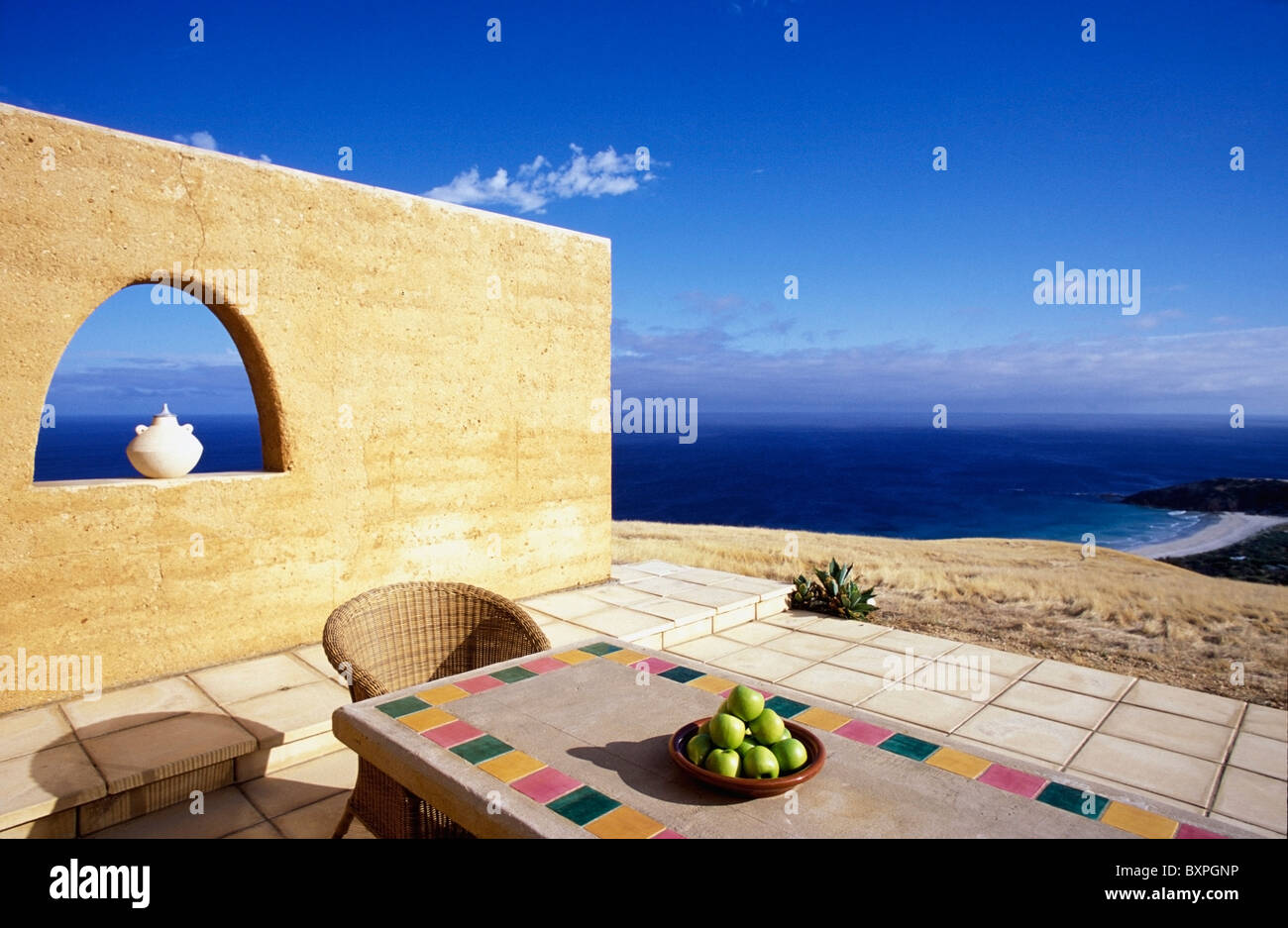 Table And Chair On Patio Overlooking Coastline Stock Photo - Alamy