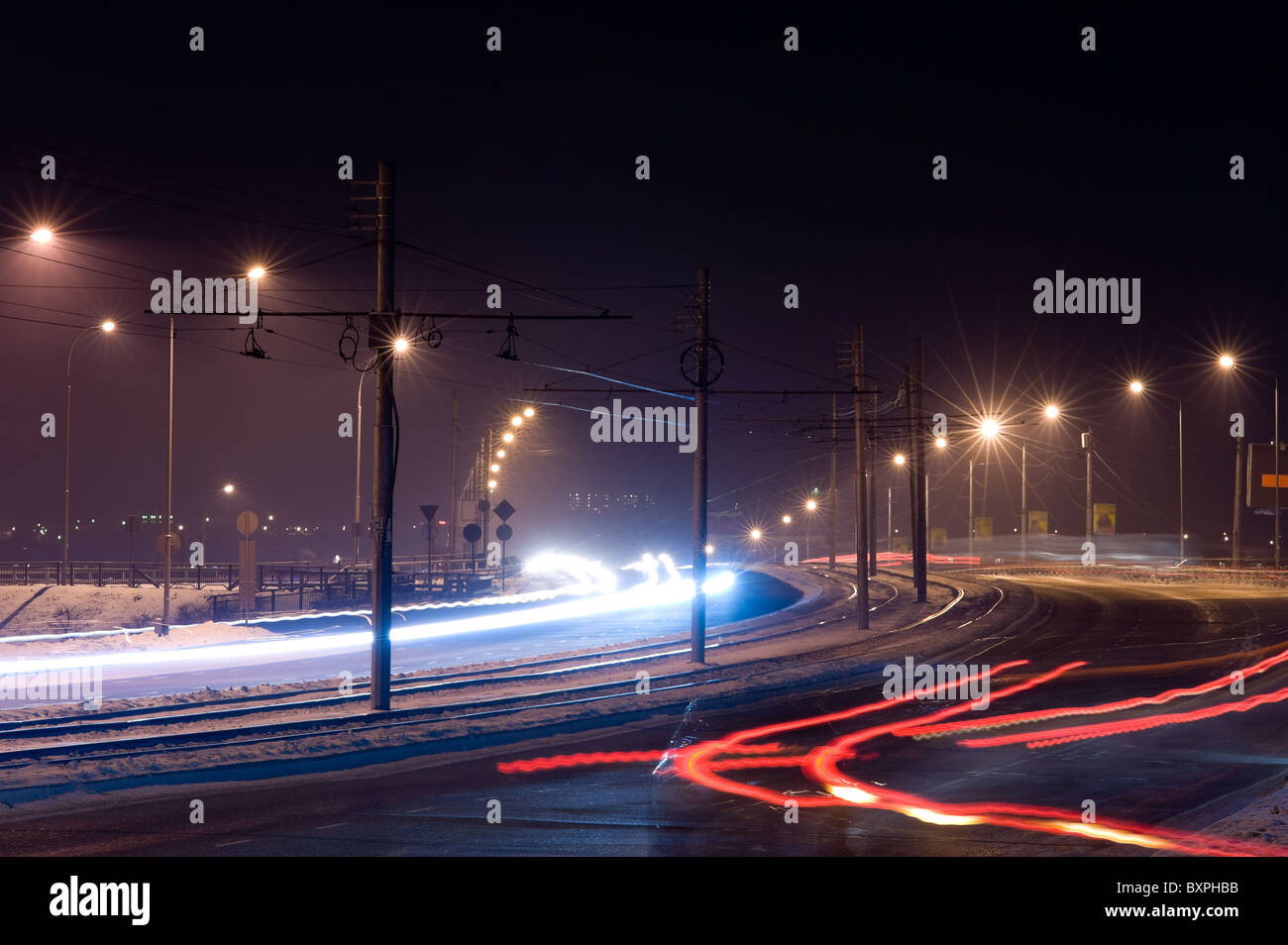 night city traffic lights in motion under street lamps Stock Photo - Alamy