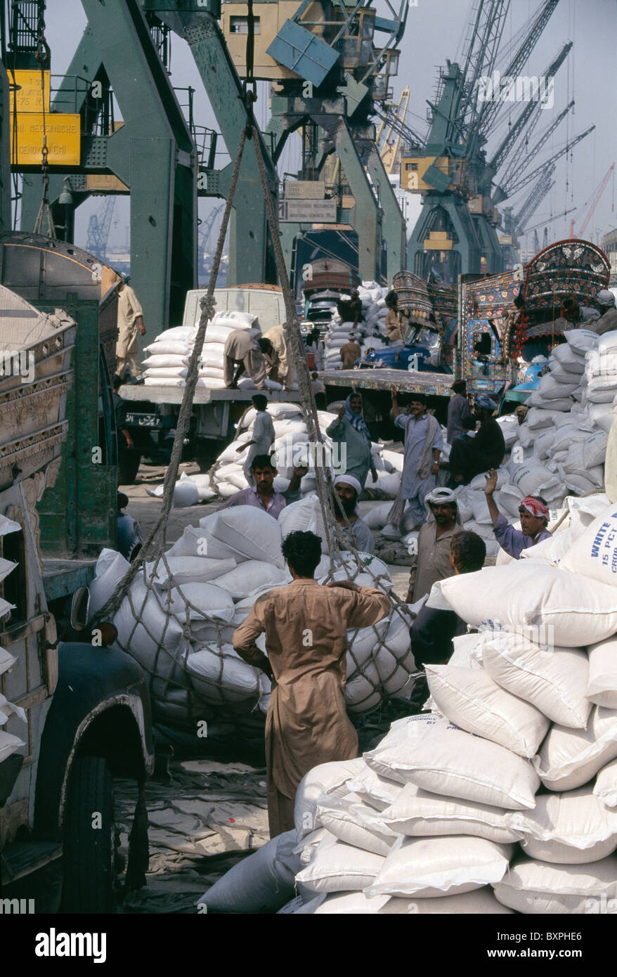 Sacks of Pakistani rice are loaded onto a ship for export in the port ...