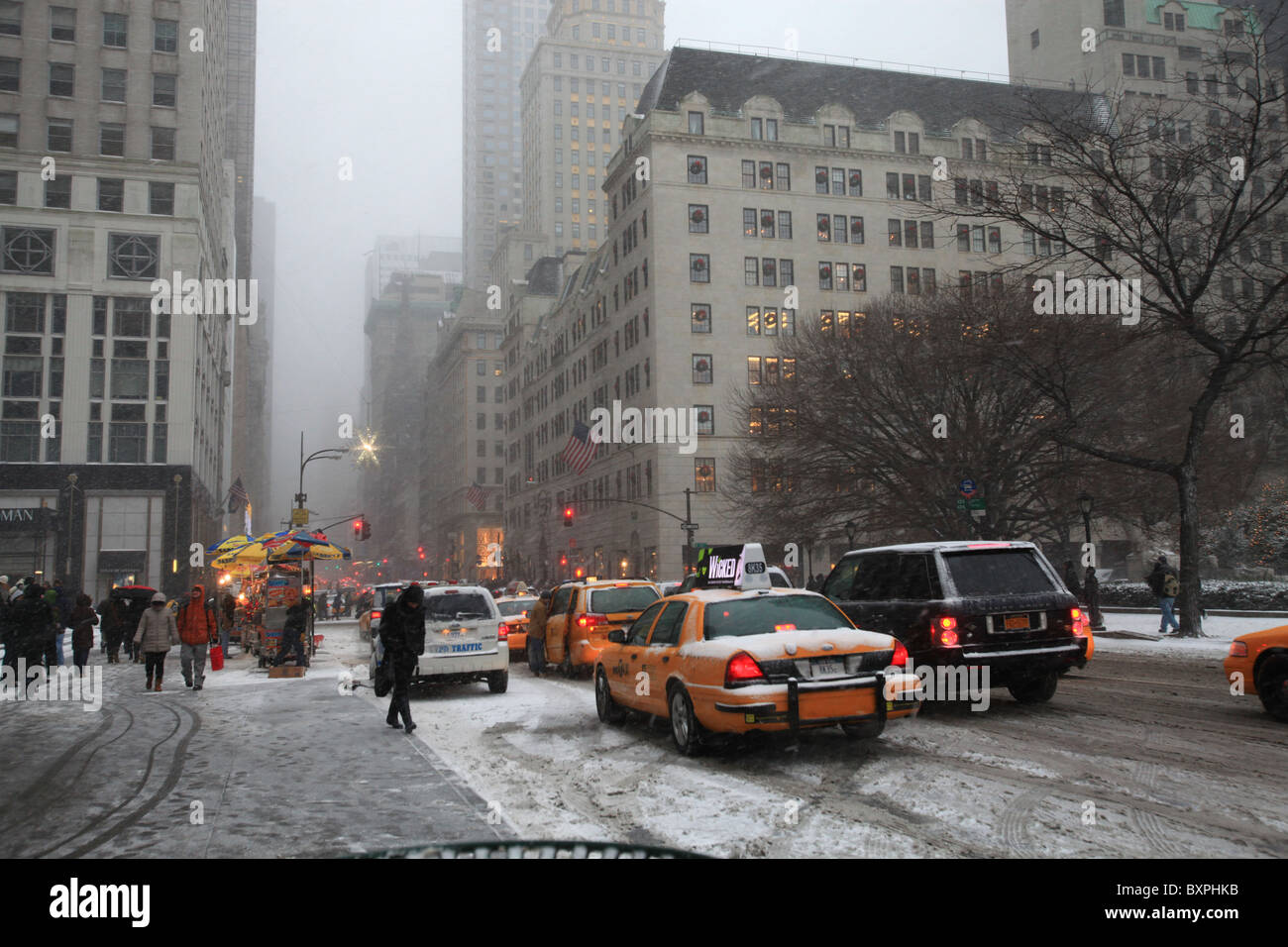 Cars and taxi stopped at red light on Fifth ave in New York city in the ...