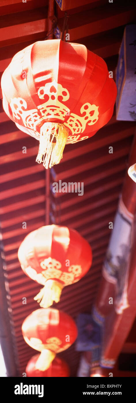Red Lanterns Hanging From Roof, Close-Up Stock Photo - Alamy