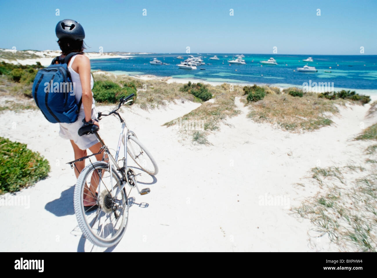 Woman bike beach one person rear view hi-res stock photography and ...