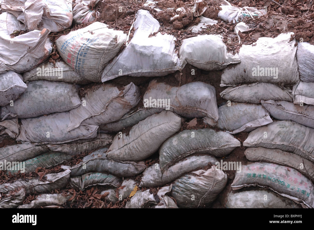 A pile of sandbags on a construction site in China Stock Photo - Alamy
