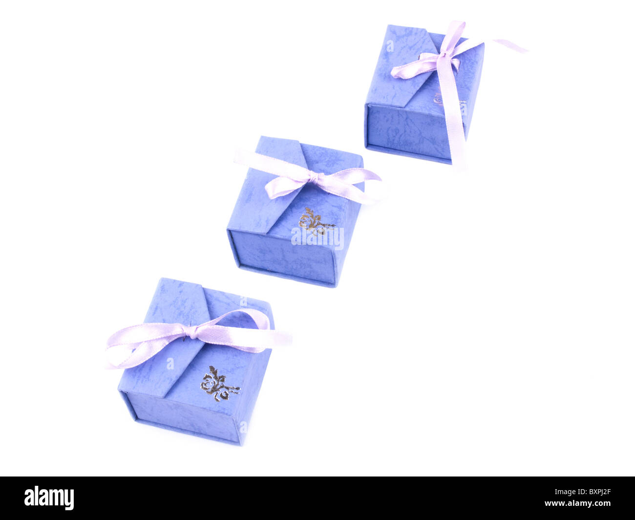 Three small lilac gift-boxes isolated on white background Stock Photo ...