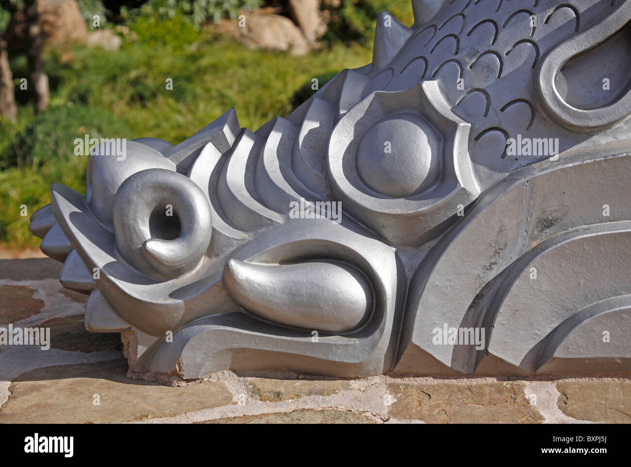 Close-up head on a statue of the Shachi mythical fish of Japan, located ...
