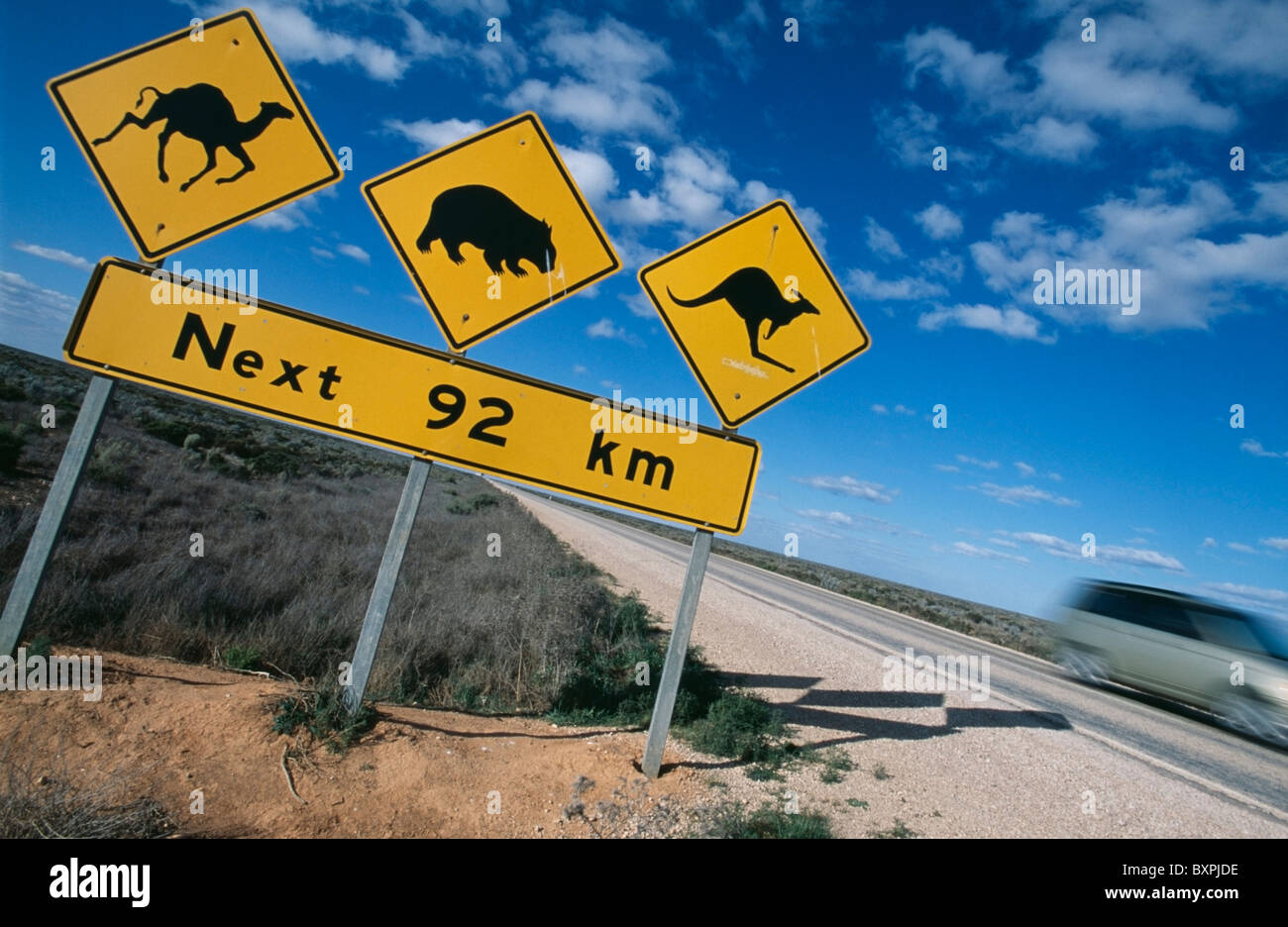 Car Driving Past Road Signs Stock Photo - Alamy