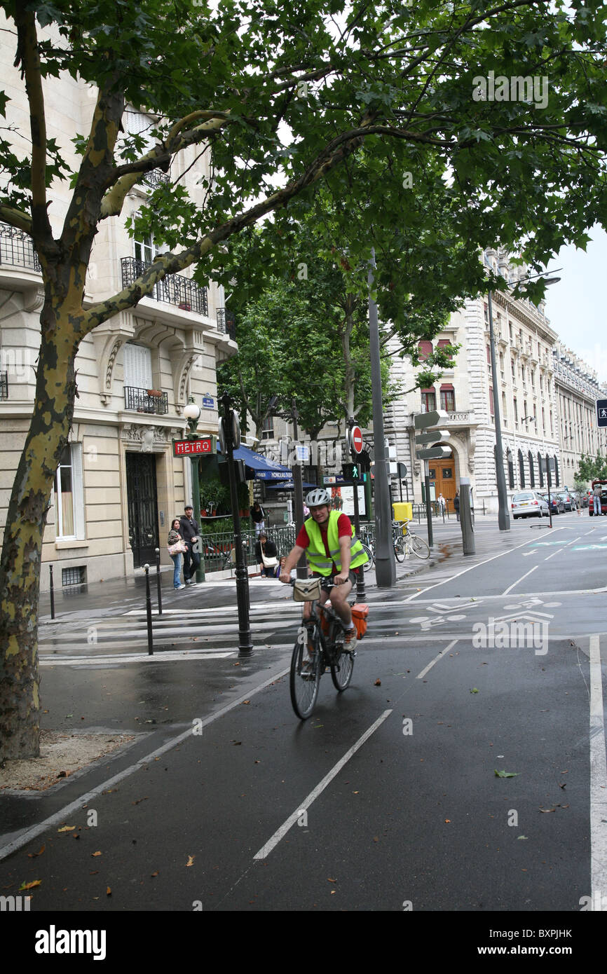 Paris Cyclist in Bicycle Lane on Street near Quai Henri IV Stock Photo ...