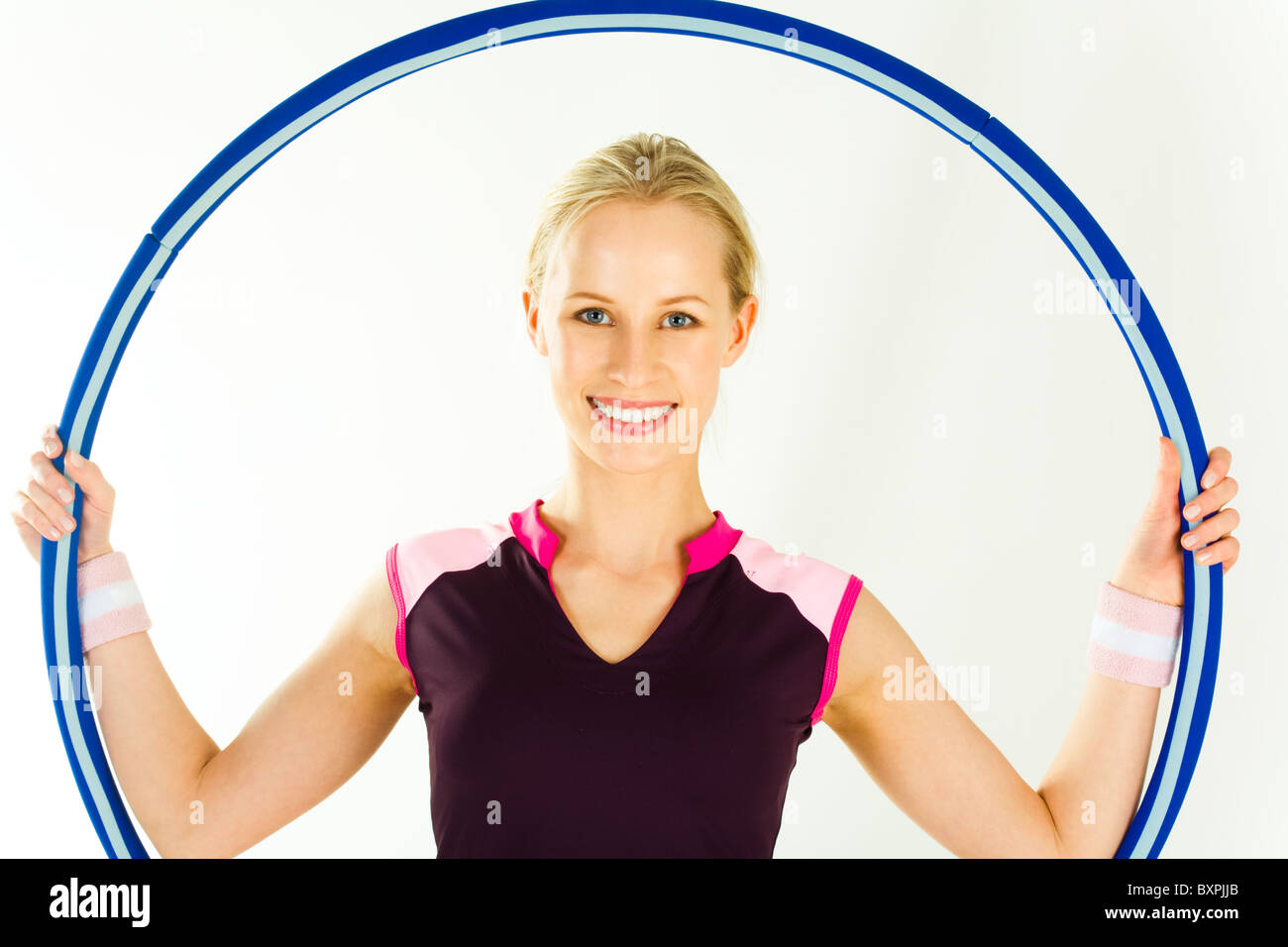 Portrait of girl holding the hoop on a white background Stock Photo - Alamy