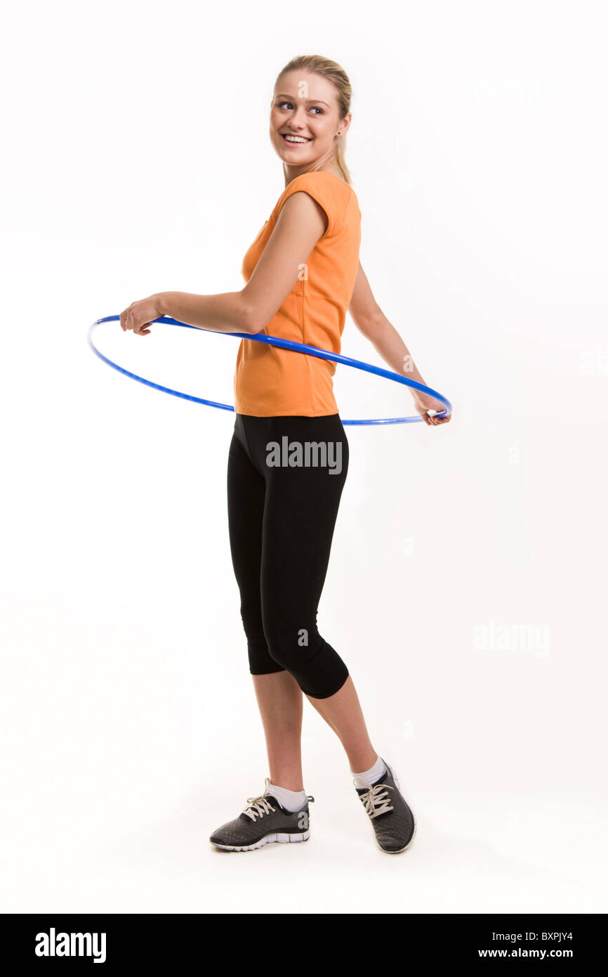 Portrait of fit girl with hoop around her looking with smile Stock ...