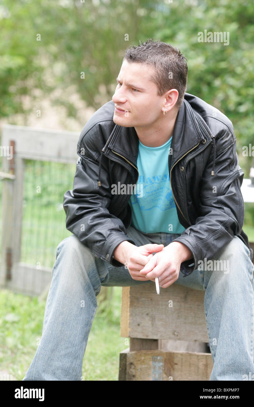Man smoking outside hi-res stock photography and images - Alamy
