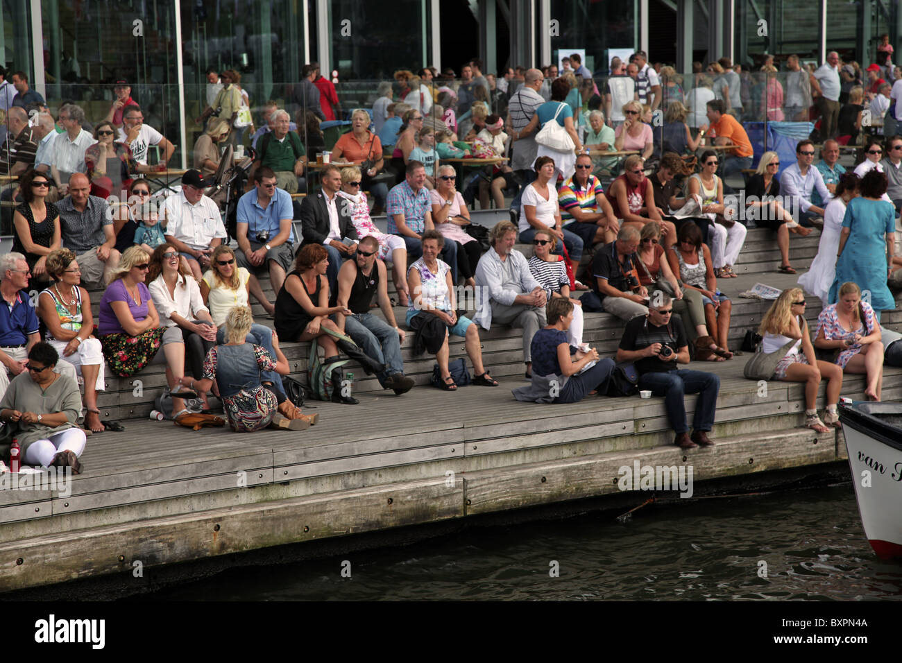People watching sailing ships go by during Amsterdam Sail 2010 Stock ...