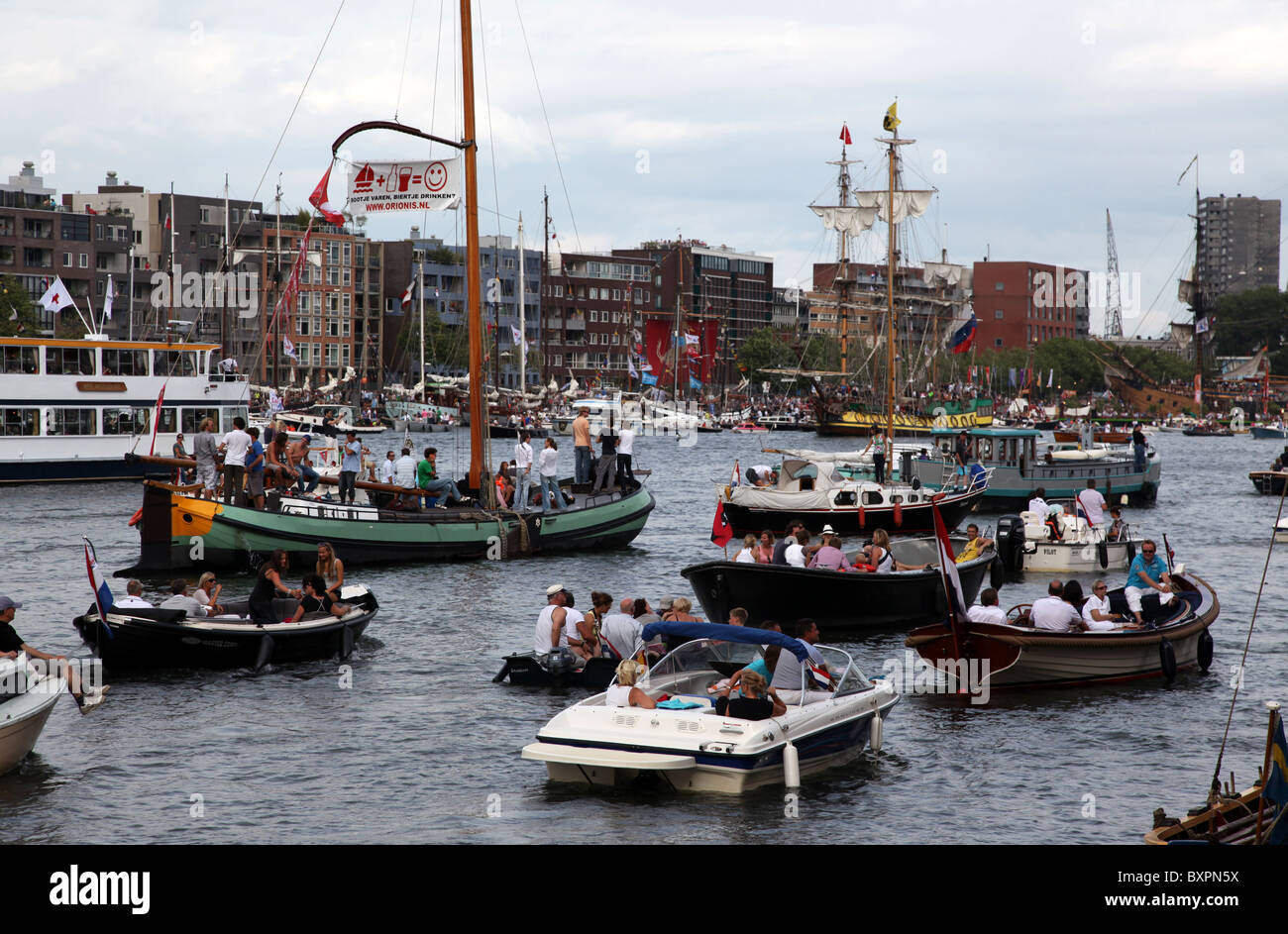 Small vessels and bigger sailing ships going down the river IJ during ...