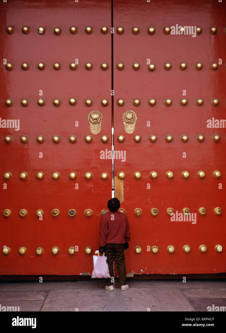 Person Peeking Through The Main Gates To The Forbidden City Stock Photo ...