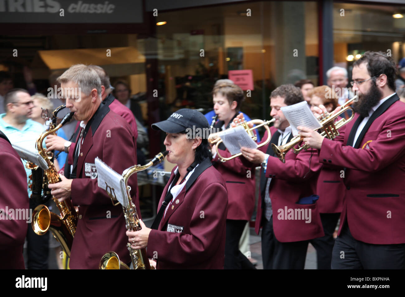 Procession of brass bands during summer festivities in Cochen Stock ...
