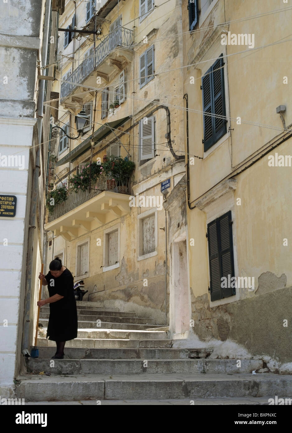 Woman Sweeping Steps Stock Photo - Alamy