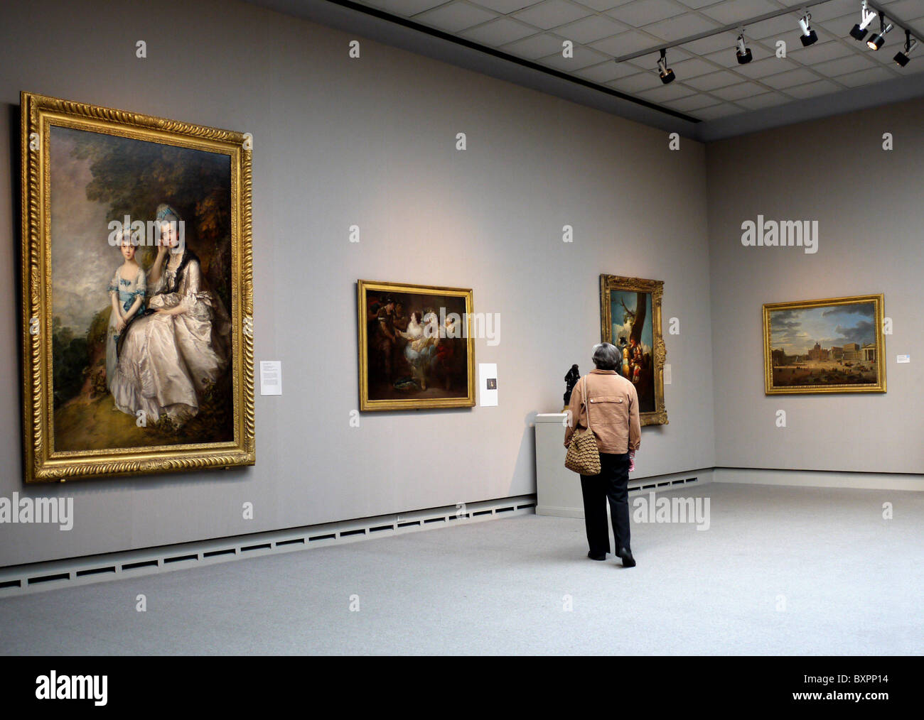 Woman at art gallery Stock Photo - Alamy