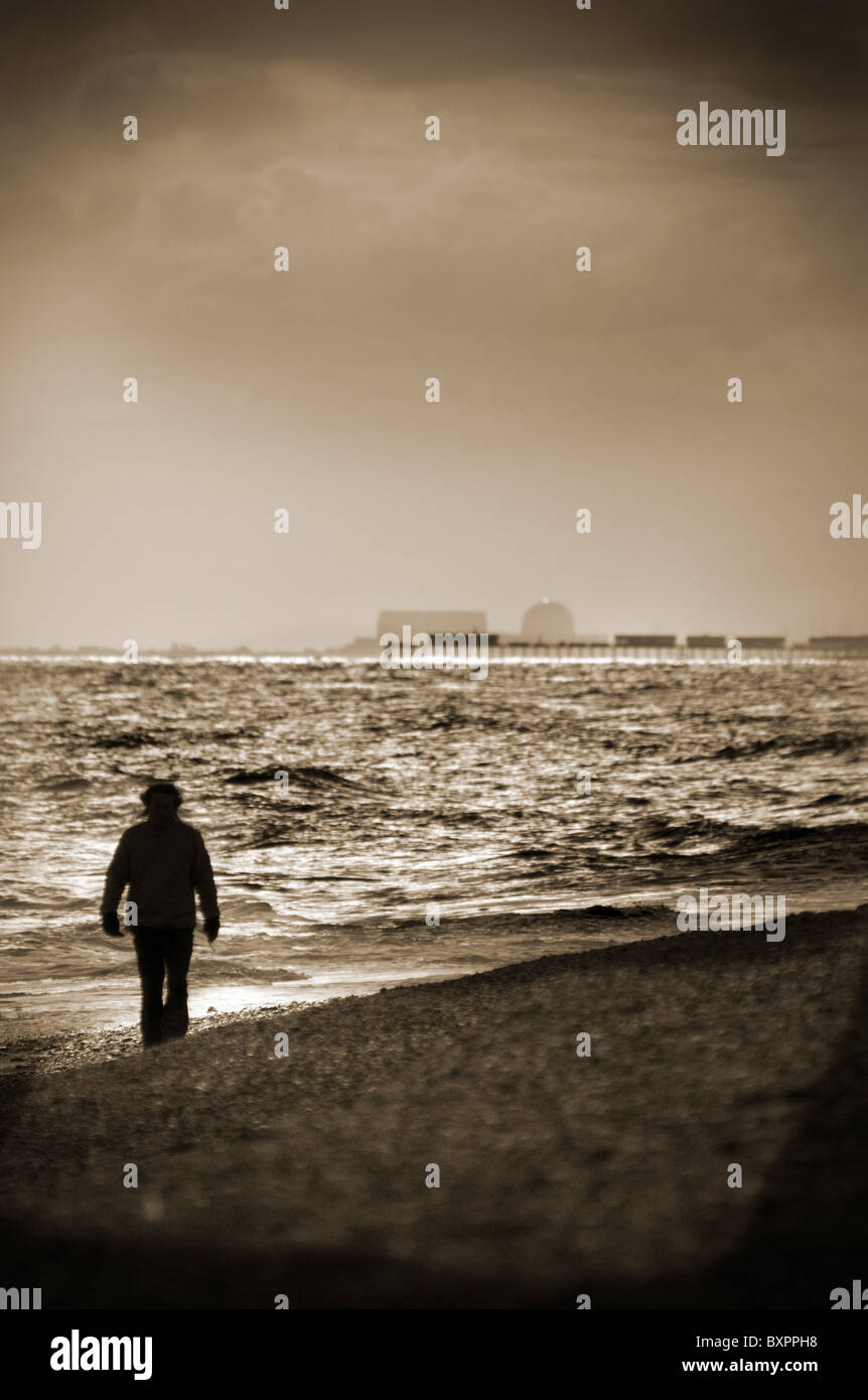 Figure walking alone on the beach hi-res stock photography and images ...
