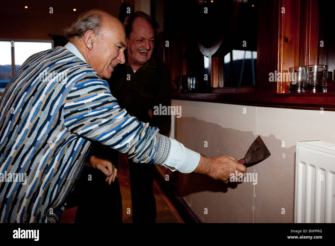 Liberal Democrat Vince Cable MP stripping wallpaper after Windermere ...