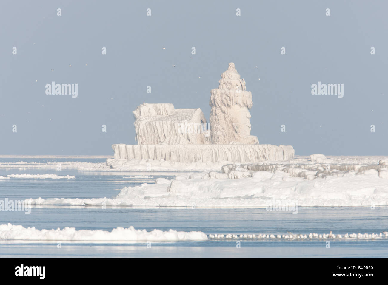 The Cleveland Harbor West Pierhead Light covered by frozen layers of ...