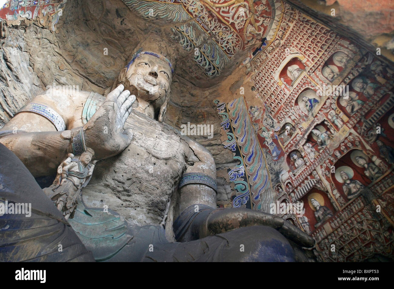 Statue And Carvings In Ancient Buddhist Temple Grotto Stock Photo - Alamy