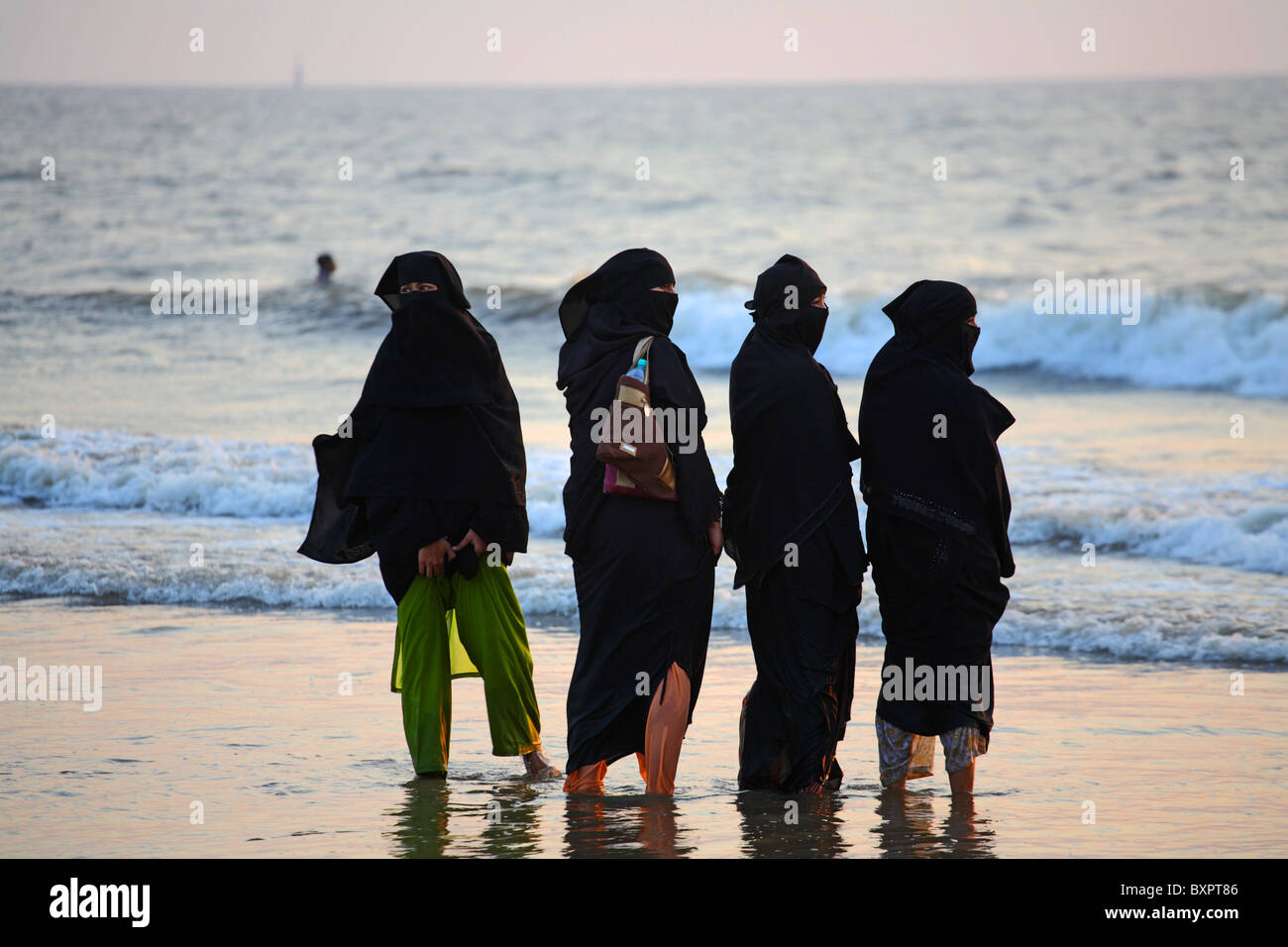 Muslim women paddling in the sea, Juhu Beach, Mumbai, India Stock Photo ...