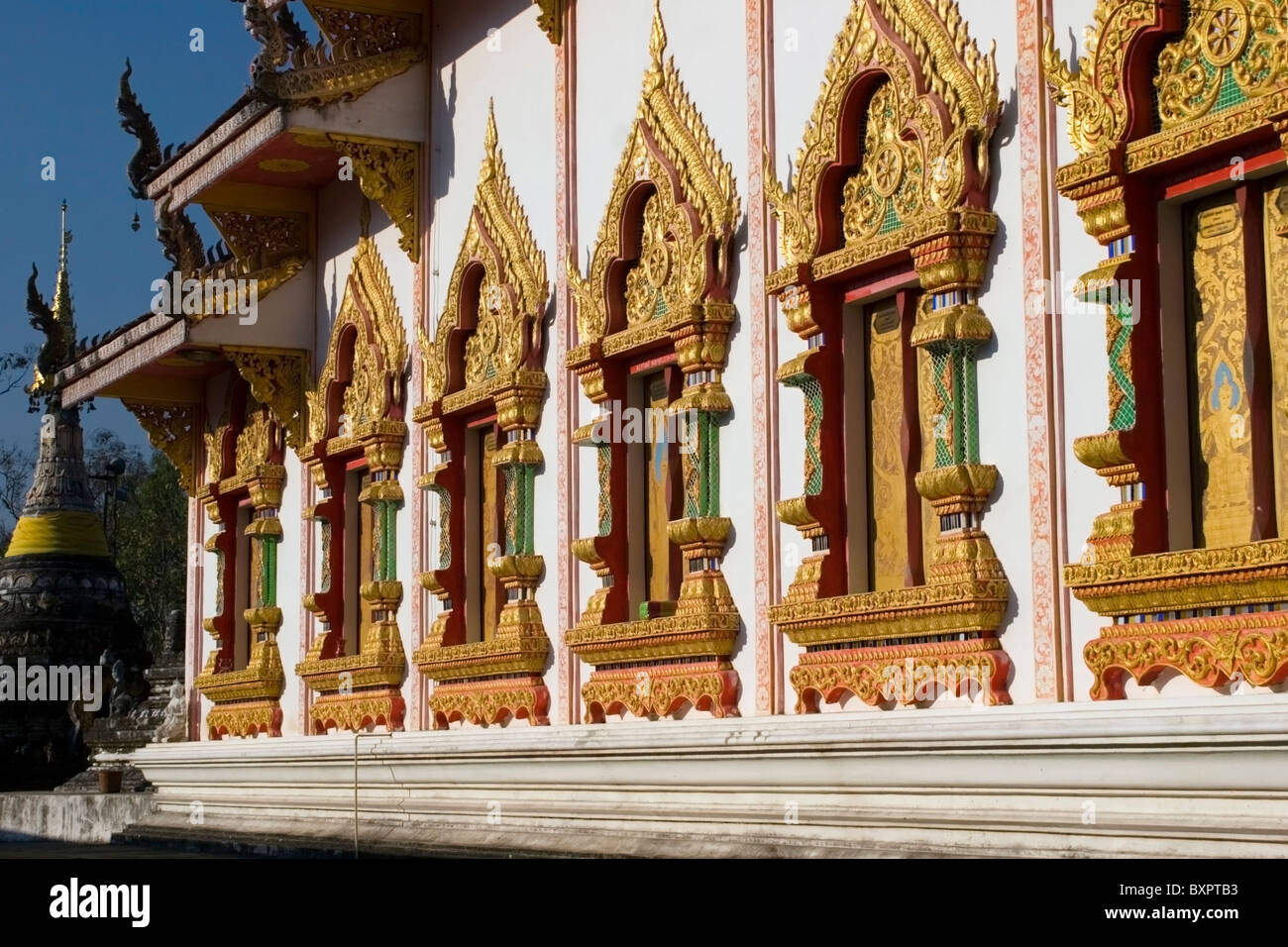 A beautiful Buddhist temple decorated with ornate designs is part of ...