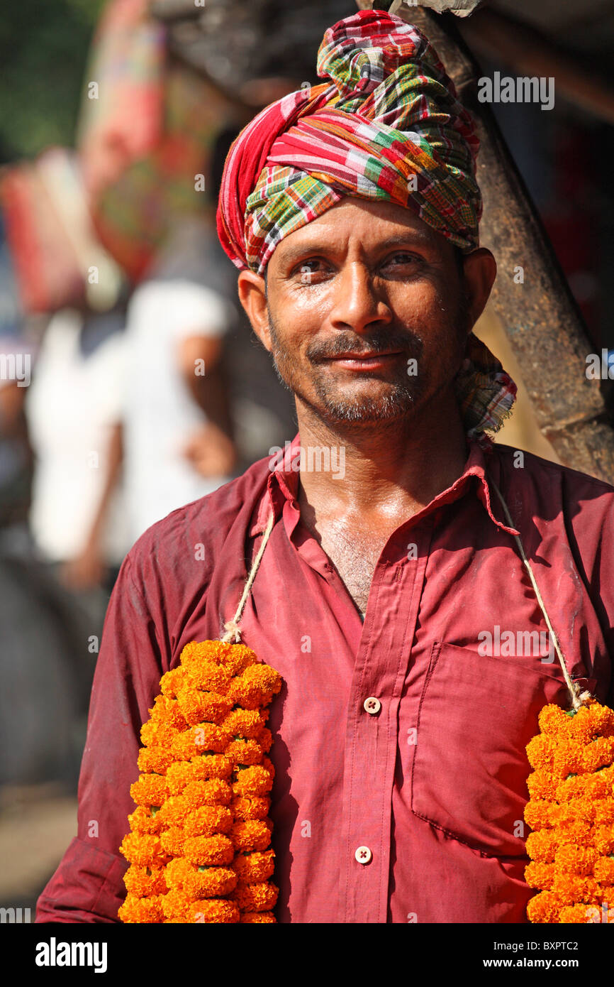 Man wearing flower garlands hi-res stock photography and images - Alamy