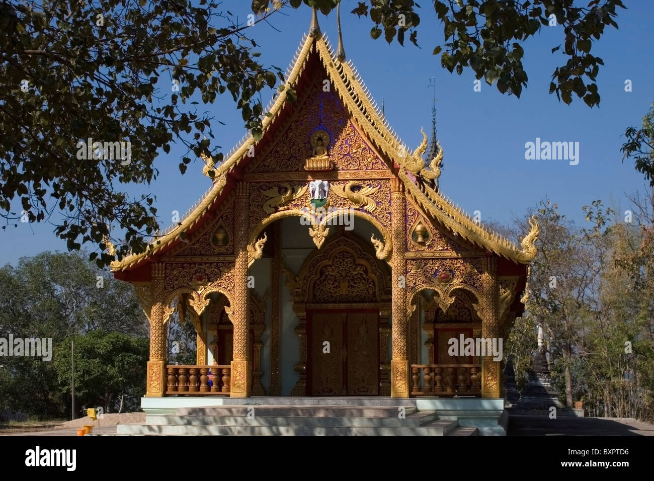 A beautiful Buddhist temple decorated with ornate designs is part of ...