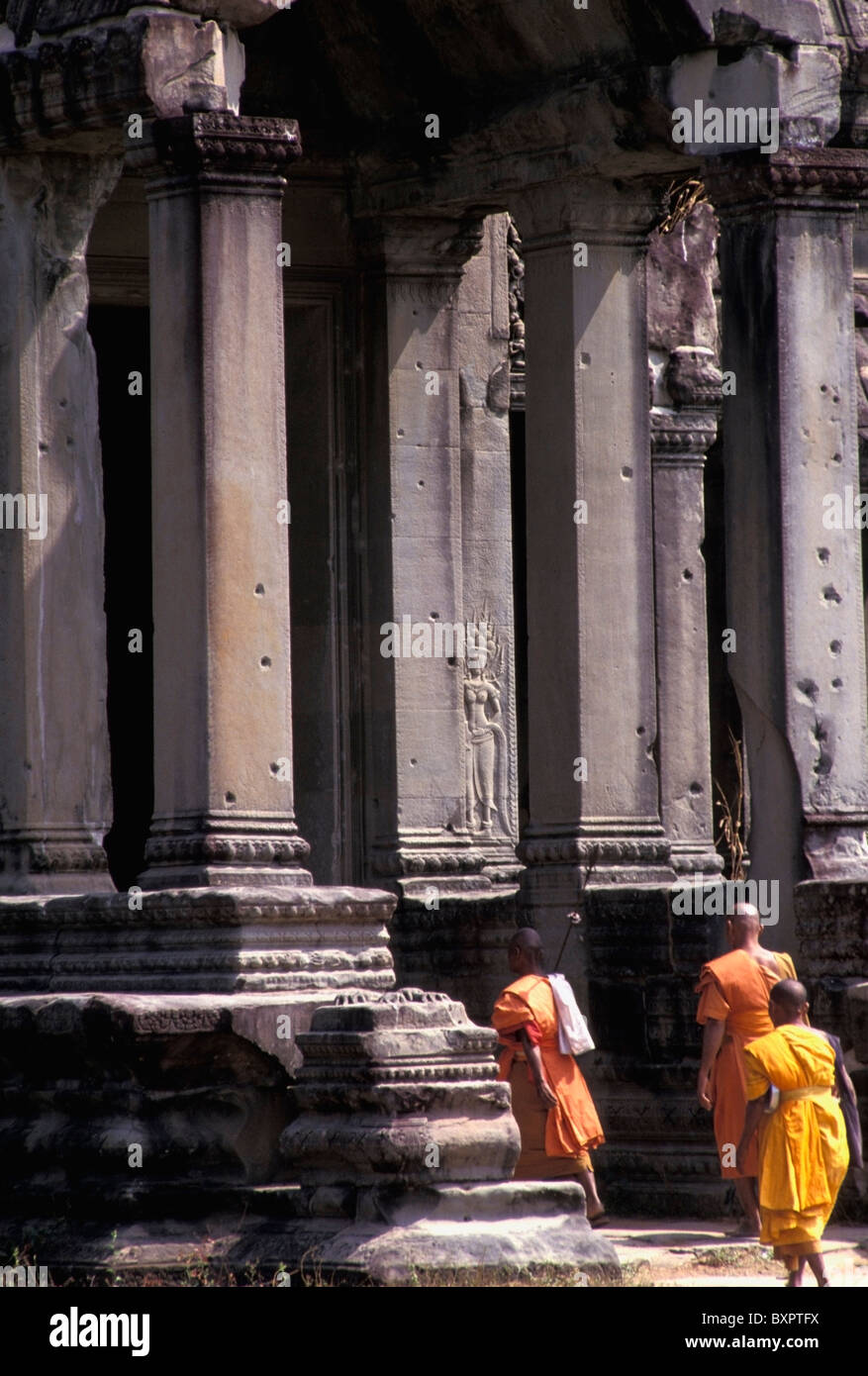 Three Monks Walking Into Angkor Wat Stock Photo - Alamy