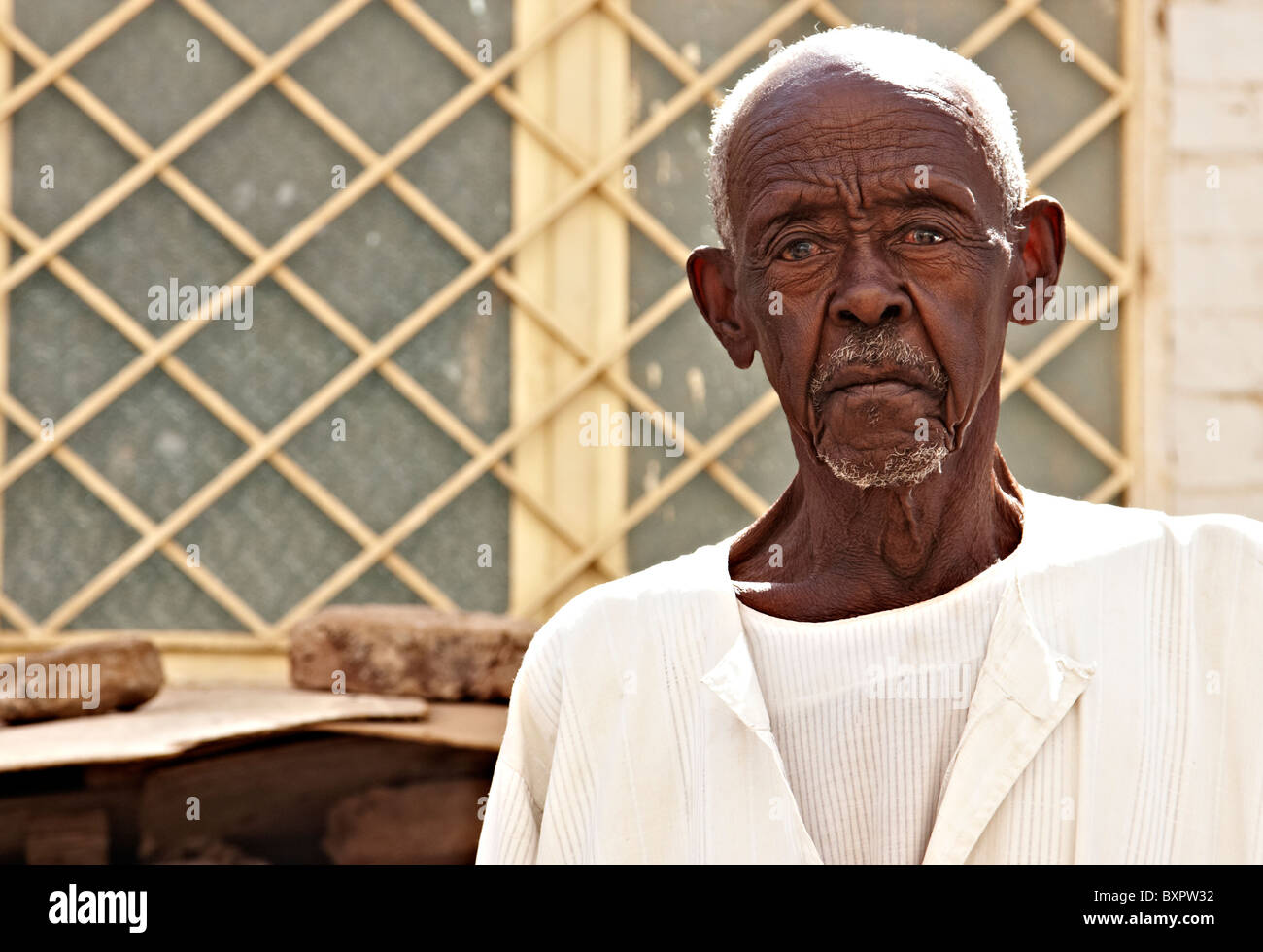 A merchant in Khartoum poses for a photograph as the future of the ...