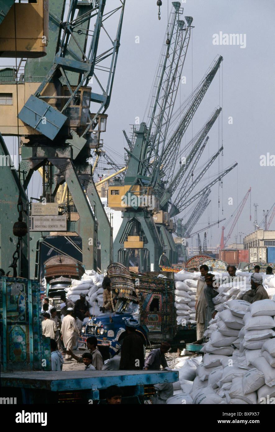 Sacks of Pakistani rice are loaded onto a ship for export in the port ...