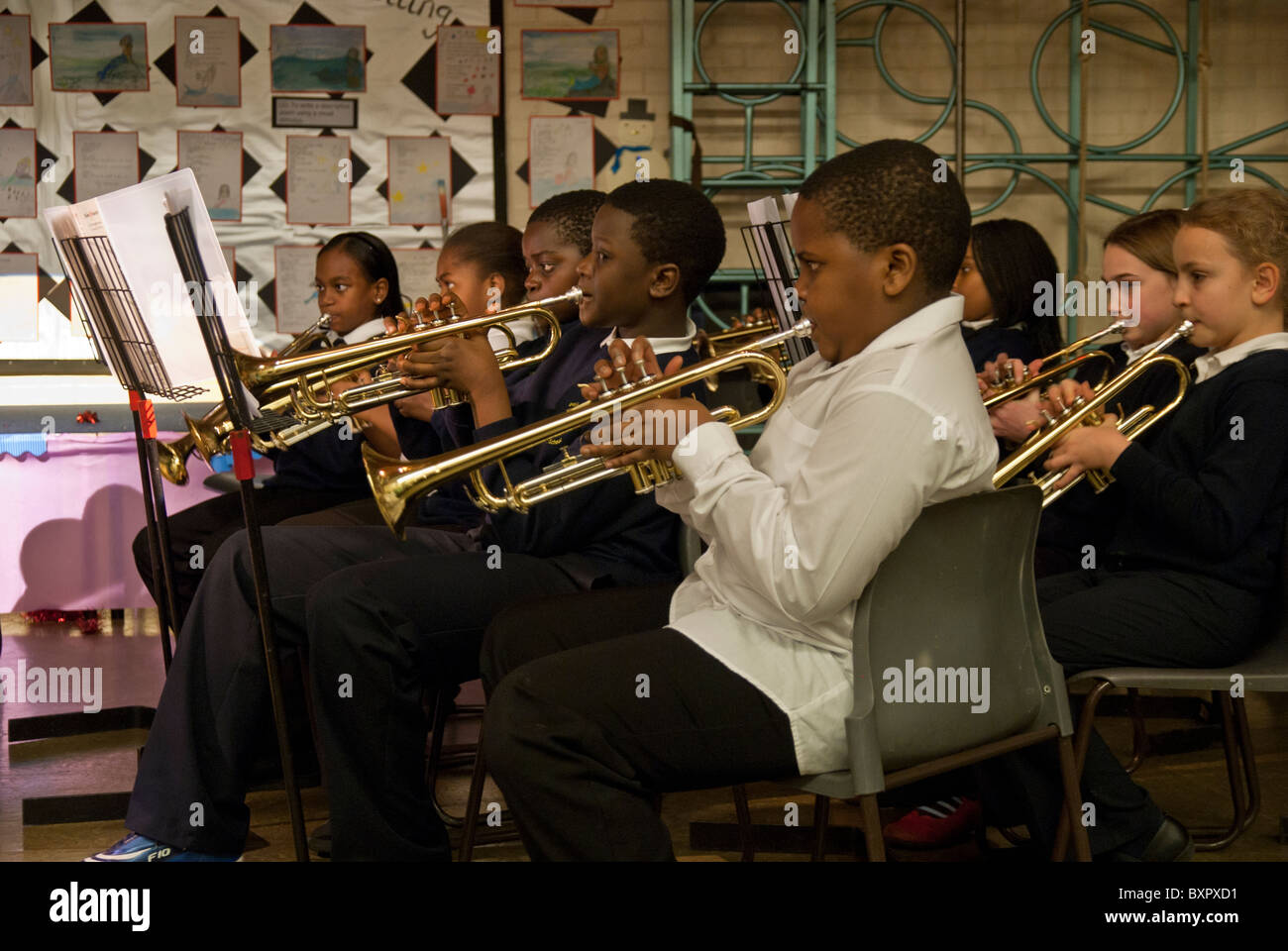 GROUP OF FROM MIX ETHNIC BACKROUND PUPILS PLAYING TRUMPET Stock Photo ...