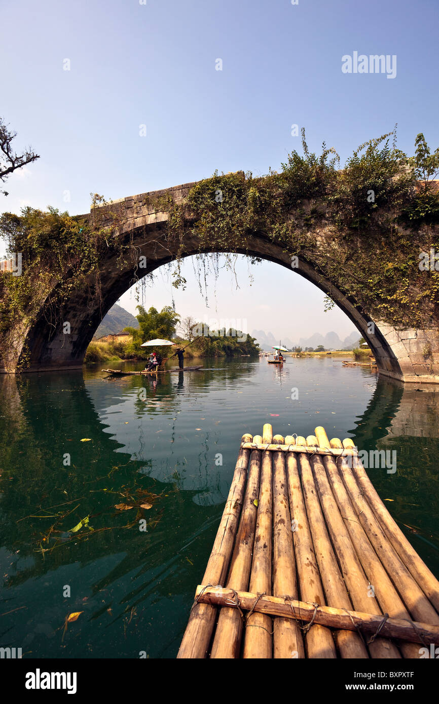China, Guangxi Province, Yangshuo. Bamboo raft on the Jade Dragon River ...