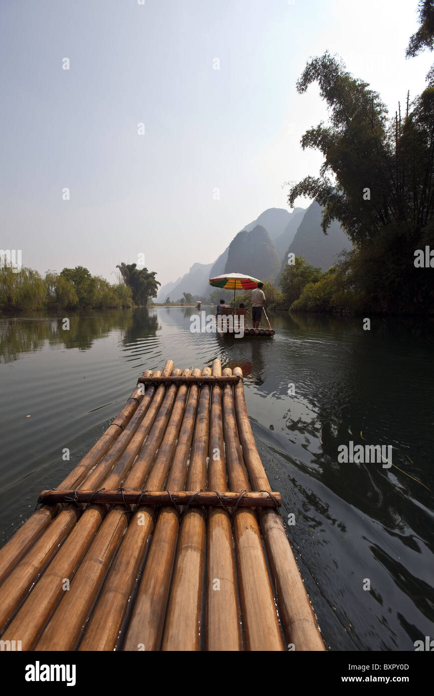 China, Guangxi Province, Yangshuo. Bamboo raft on the Jade Dragon River ...