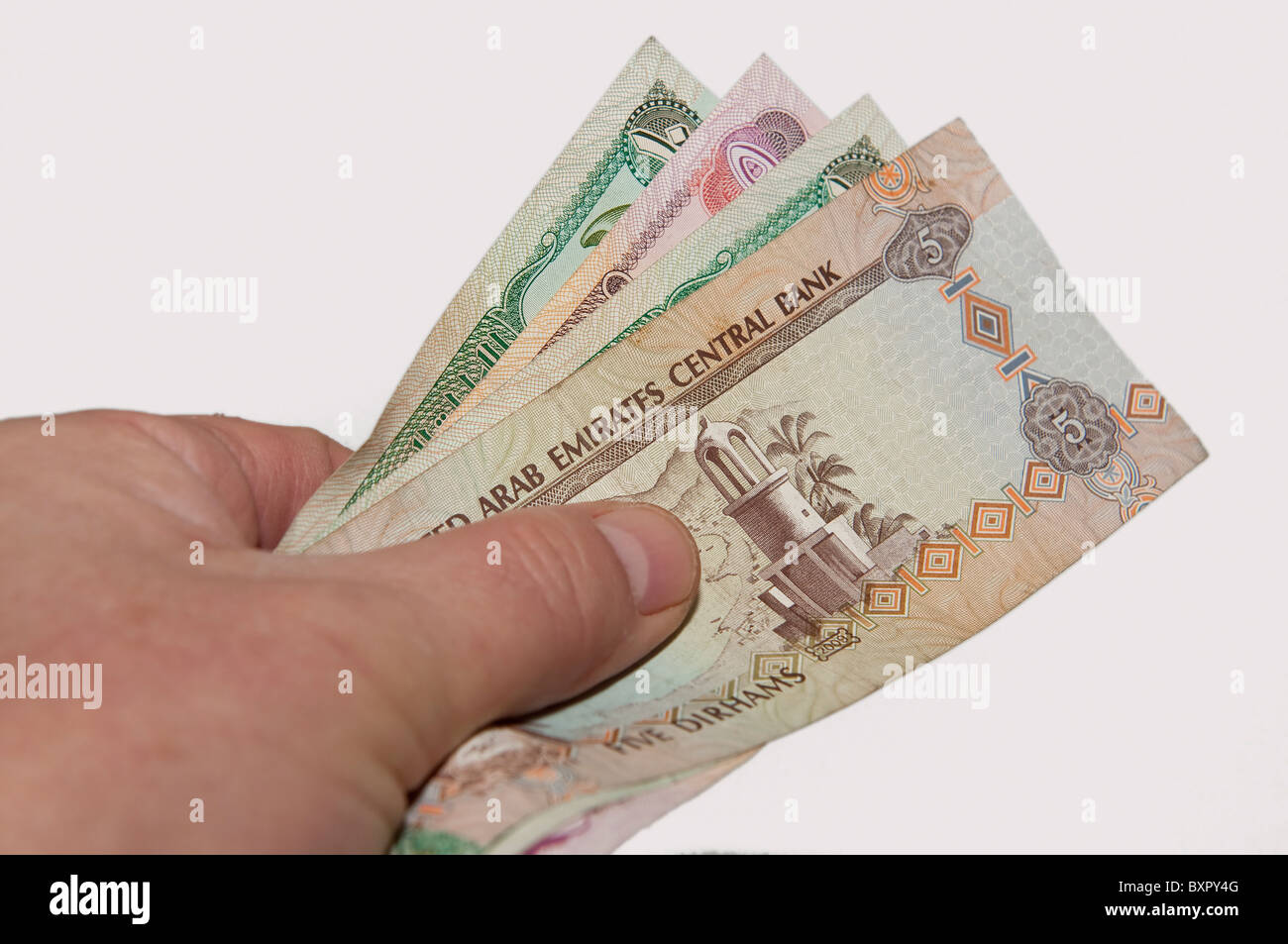 U.A.E. currency on hand Stock Photo - Alamy