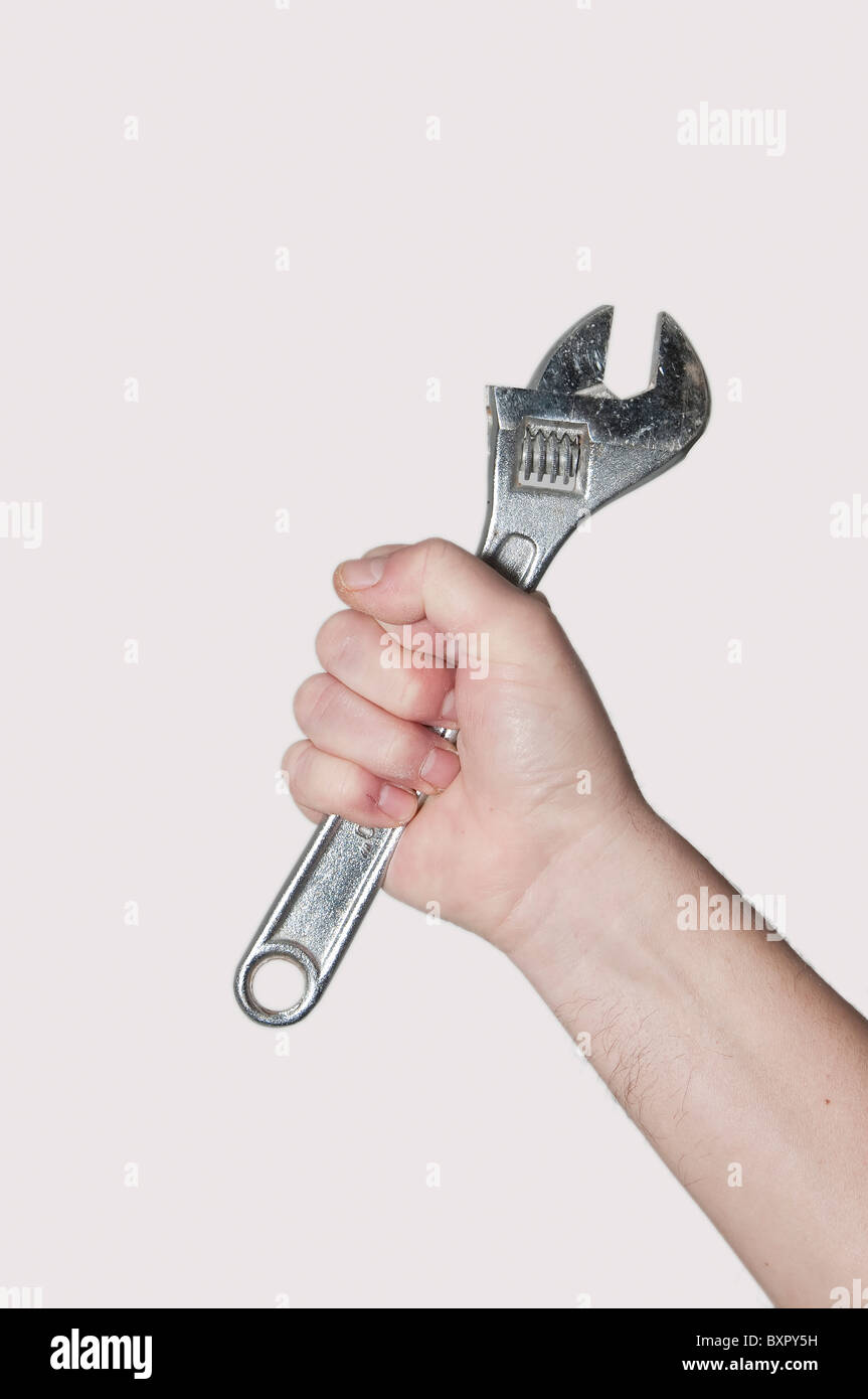 a wrench in hand Stock Photo - Alamy