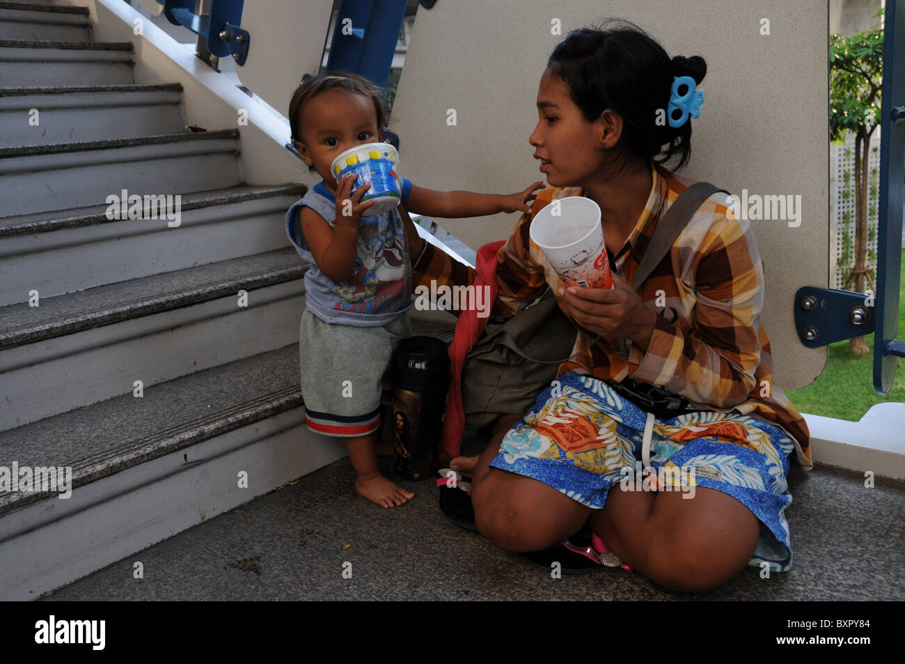 Poor Woman Begging for Money Stock Photo - Alamy