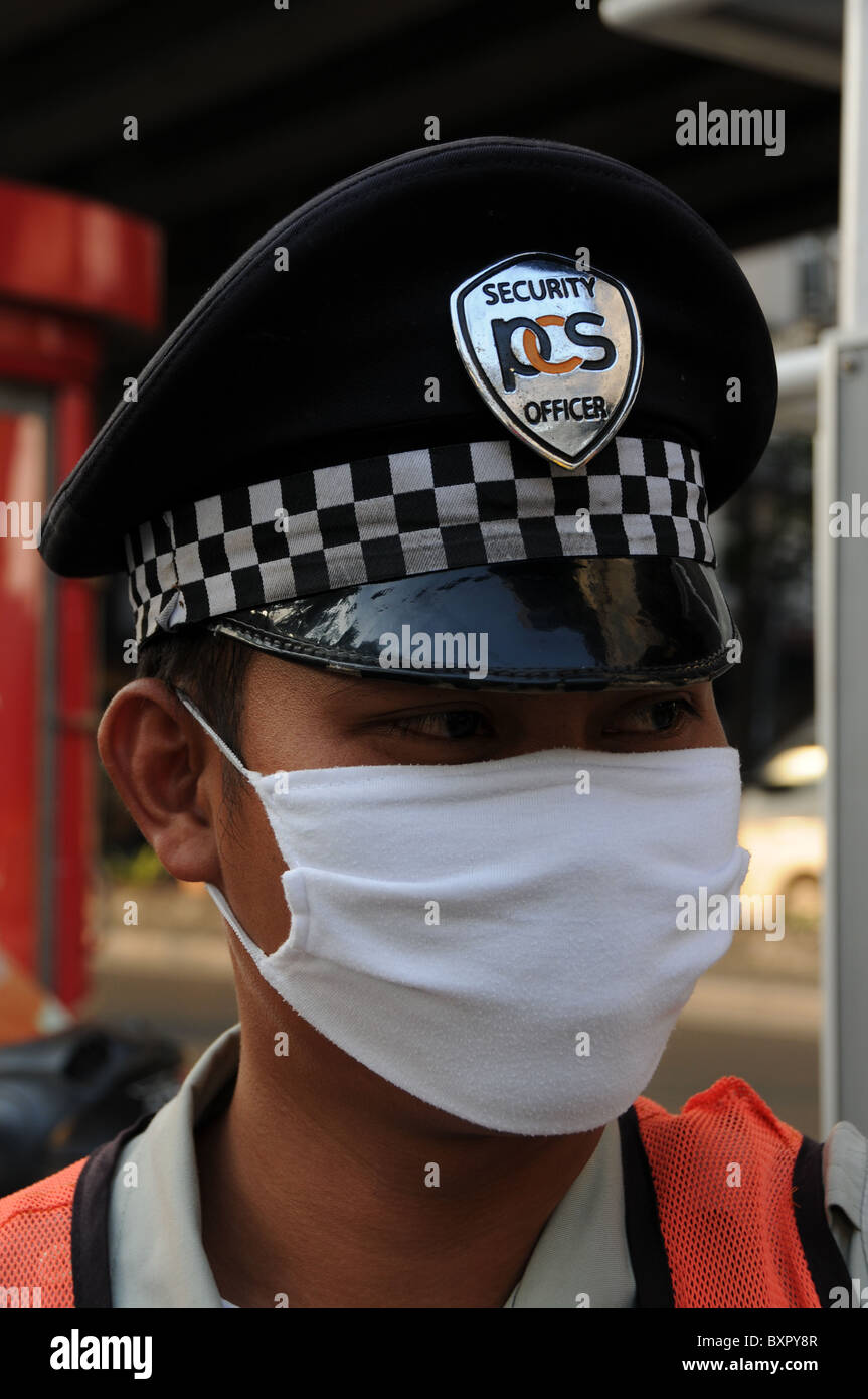 Securety with a Breathing Mask in Bangkok Stock Photo - Alamy