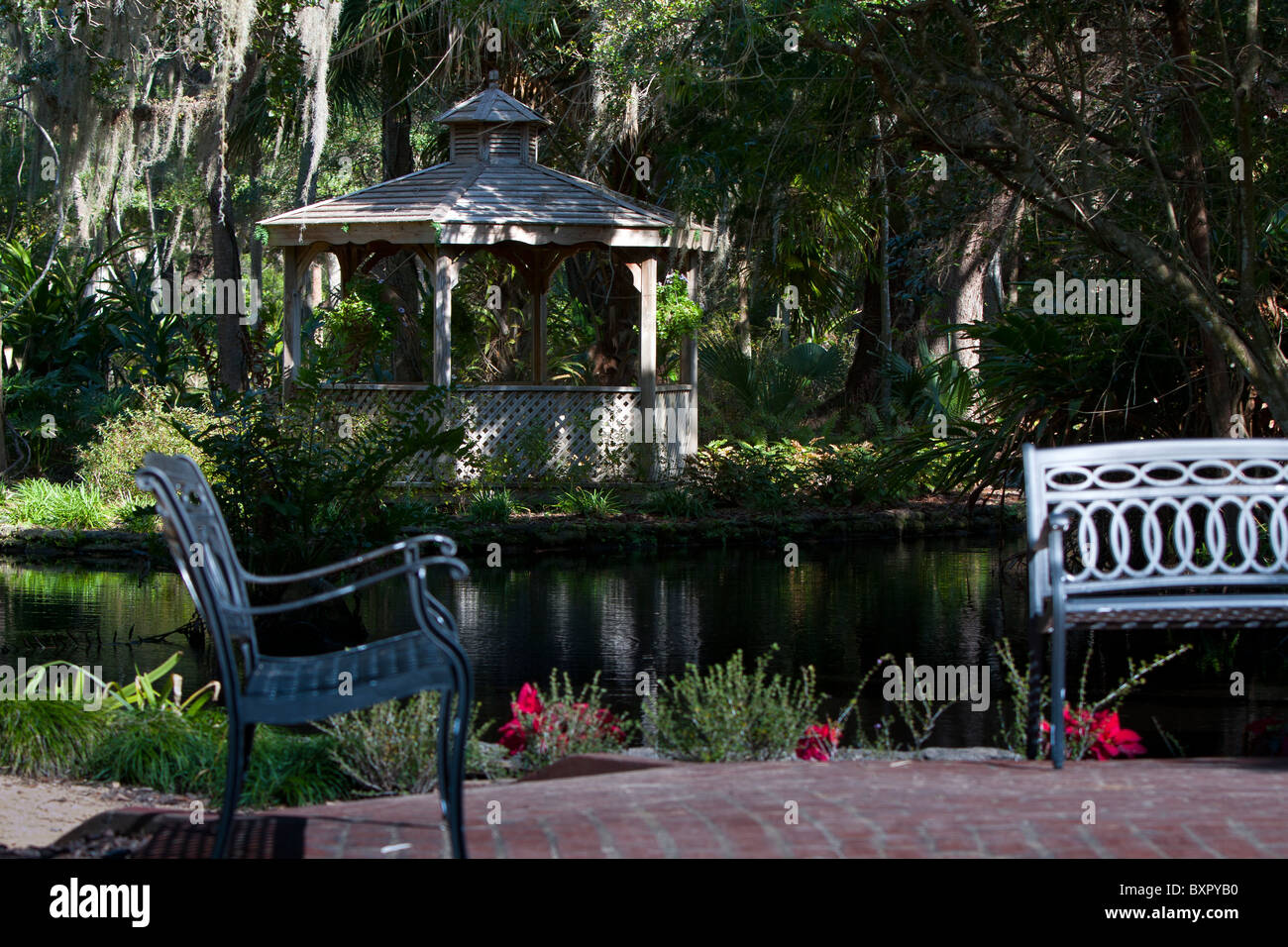 A place to relax. Park benches and an gazebo in the distance Stock ...