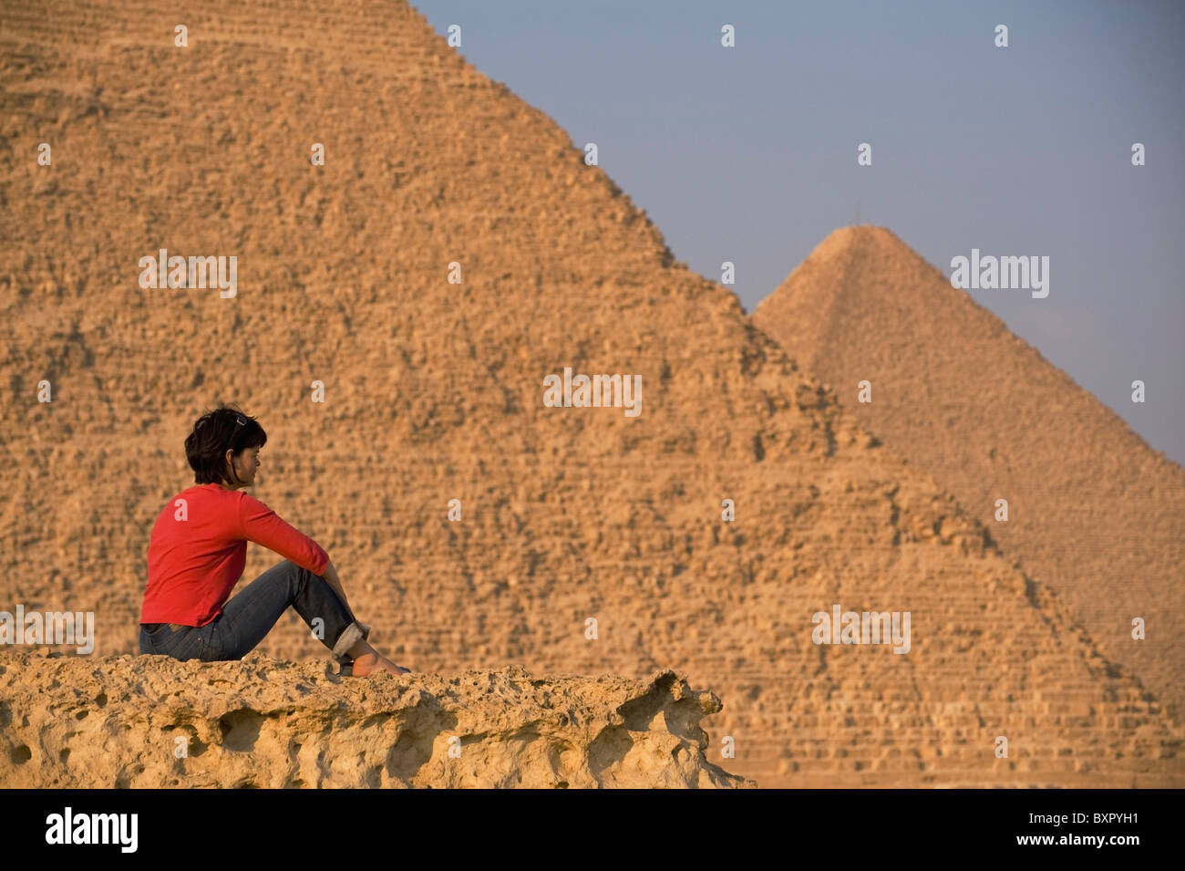 Person on top of pyramid hi-res stock photography and images - Alamy