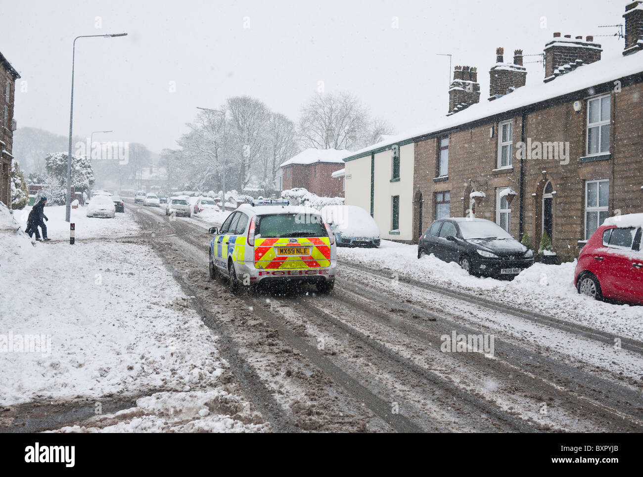 Paramedic ambulance driving on untreated snow covered road Stock Photo ...