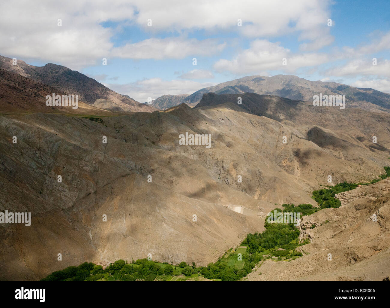 Vegetation flourishes along valley floors in the upper Atlas Mountains ...