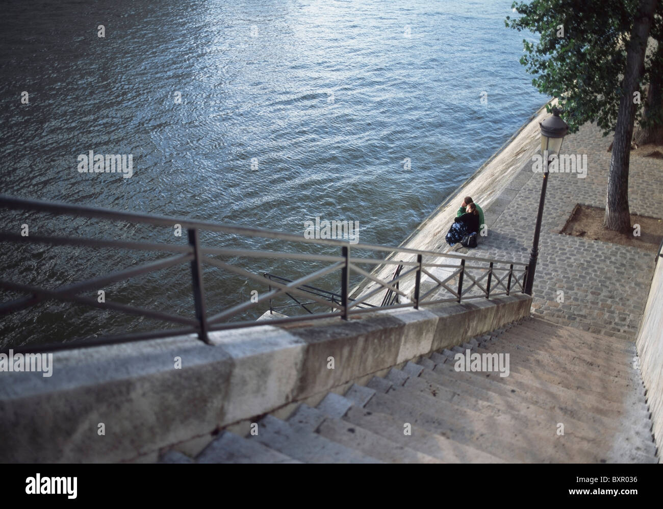 Couple on riverside railing hi-res stock photography and images - Alamy