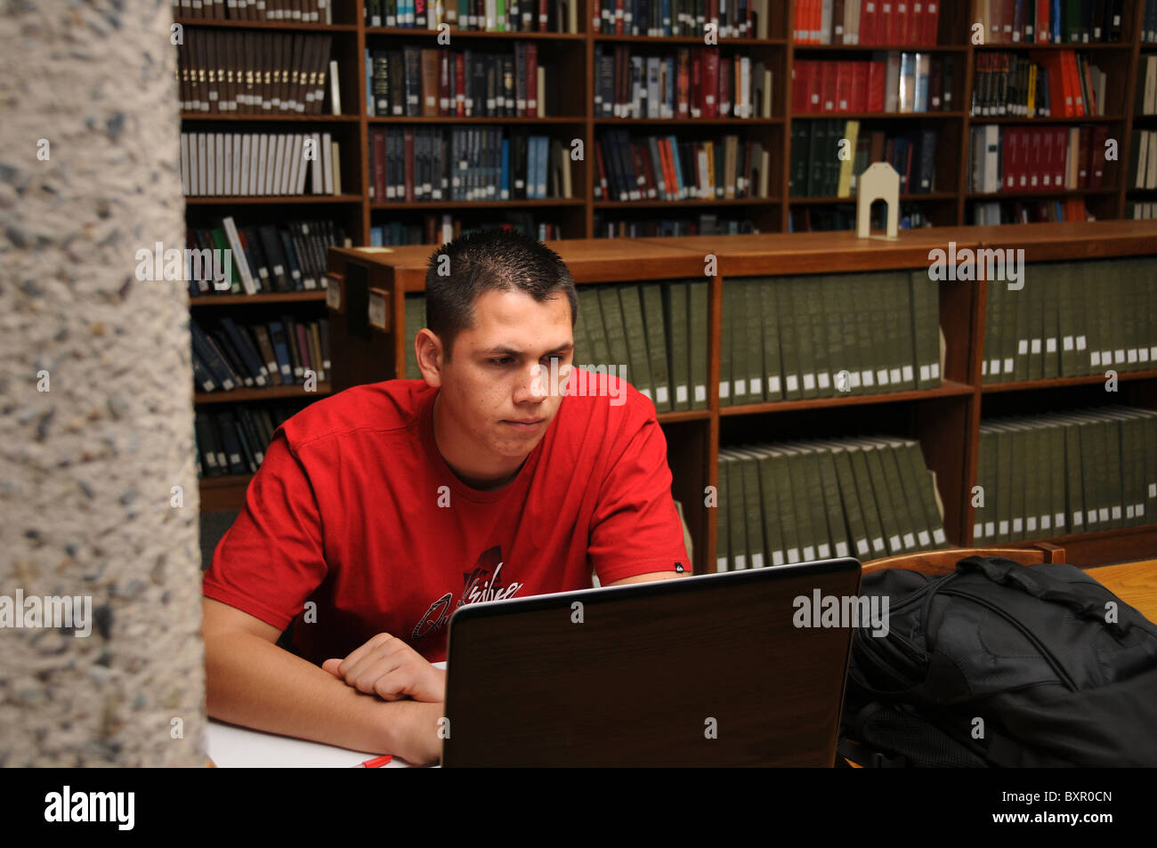 A college student works in the campus library Stock Photo - Alamy