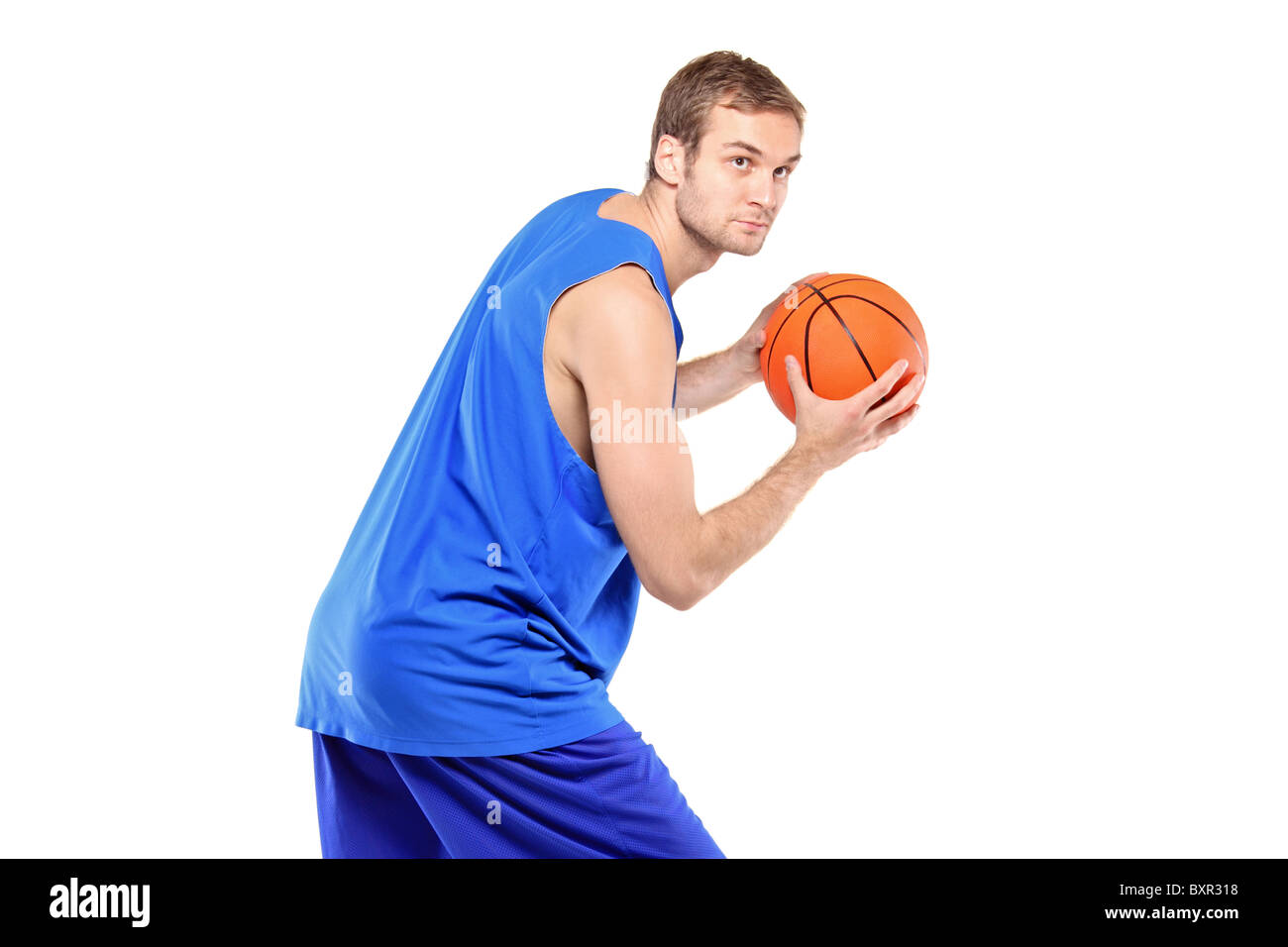 Tall male holding basketball hi-res stock photography and images - Alamy