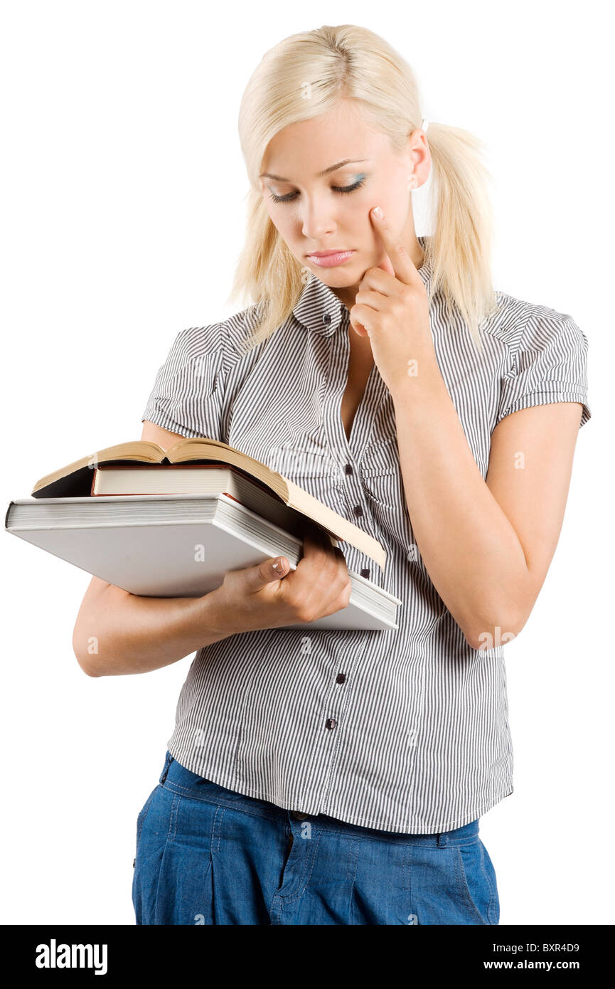 beautiful young student thinking while she is reading a book Stock ...