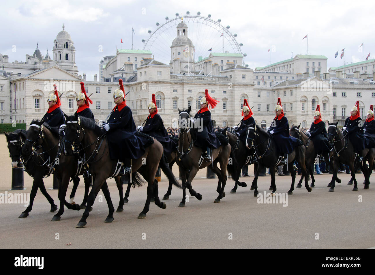 A column of Household Cavalry marching past horse guards parade with ...