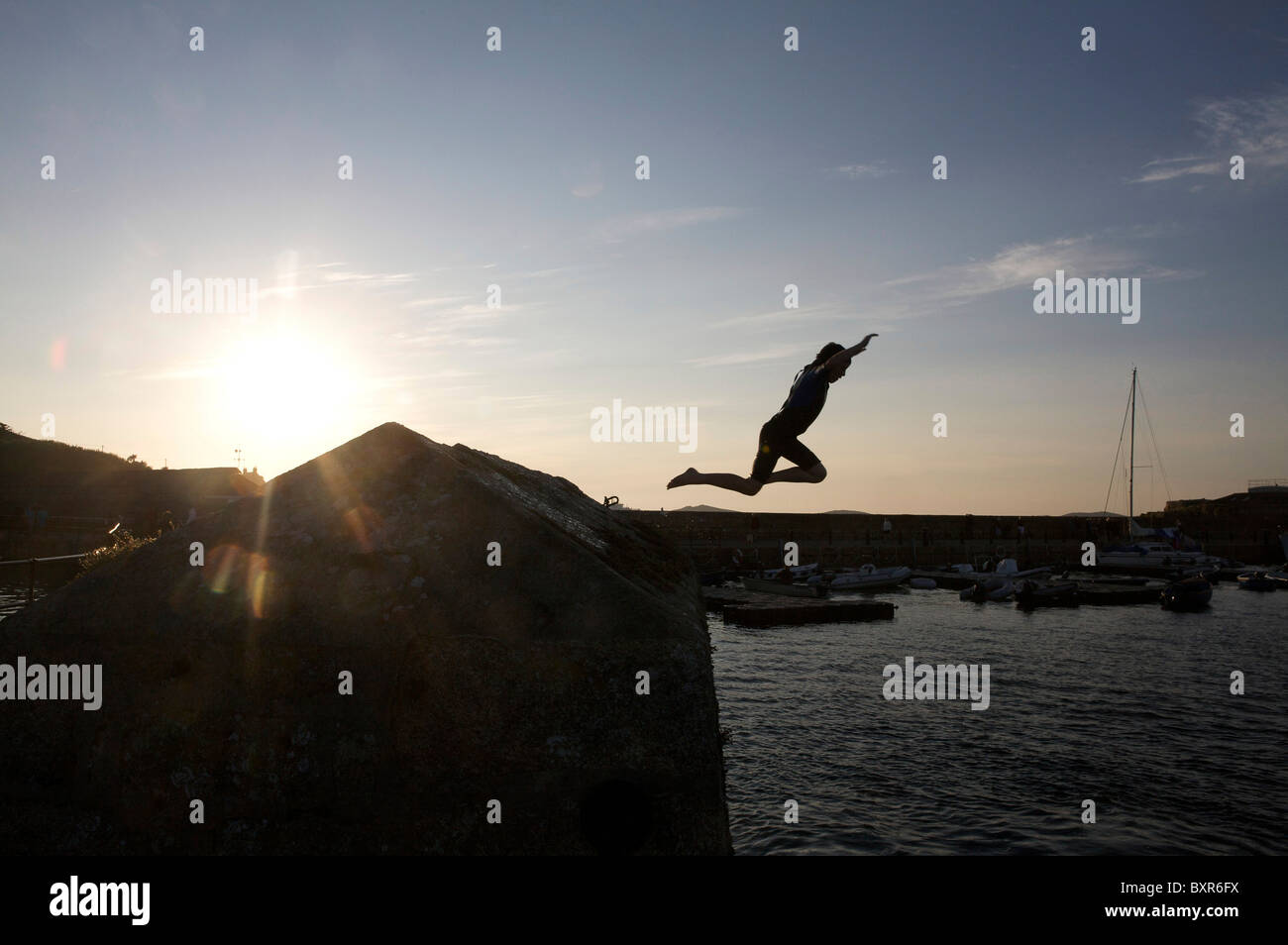 Pier jumping from the harbour wall st Mary's Isles of Scilly, uk Stock ...