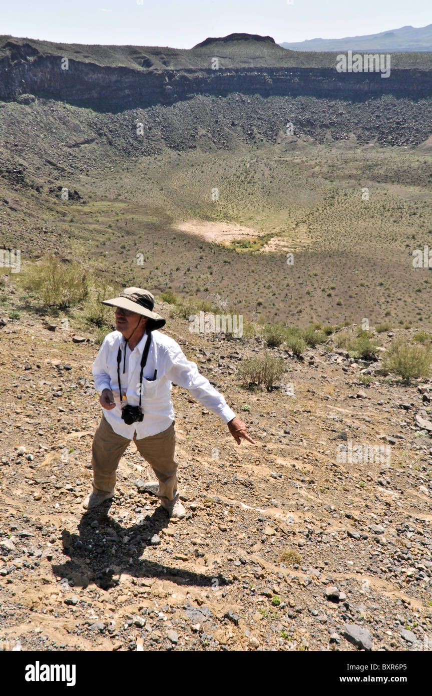 Geologist pointing out feature on Elegante Crater, a maar crater, El ...